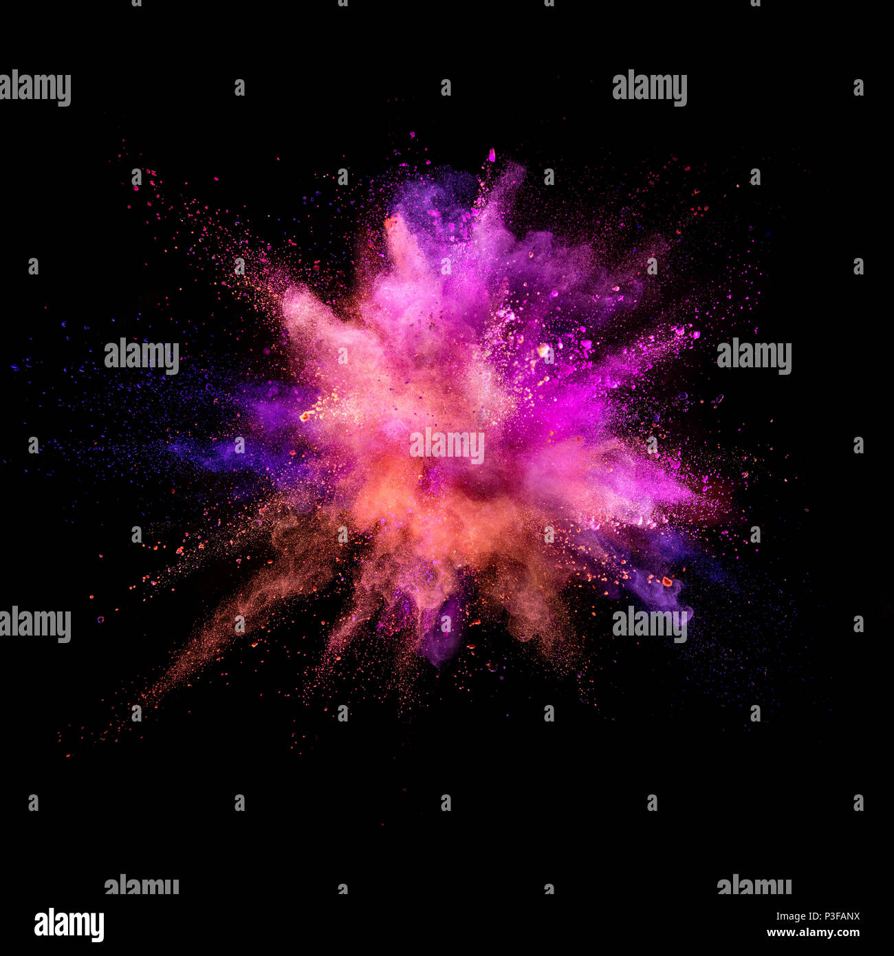 Explosion of coloured powder isolated on black background. Abstract ...