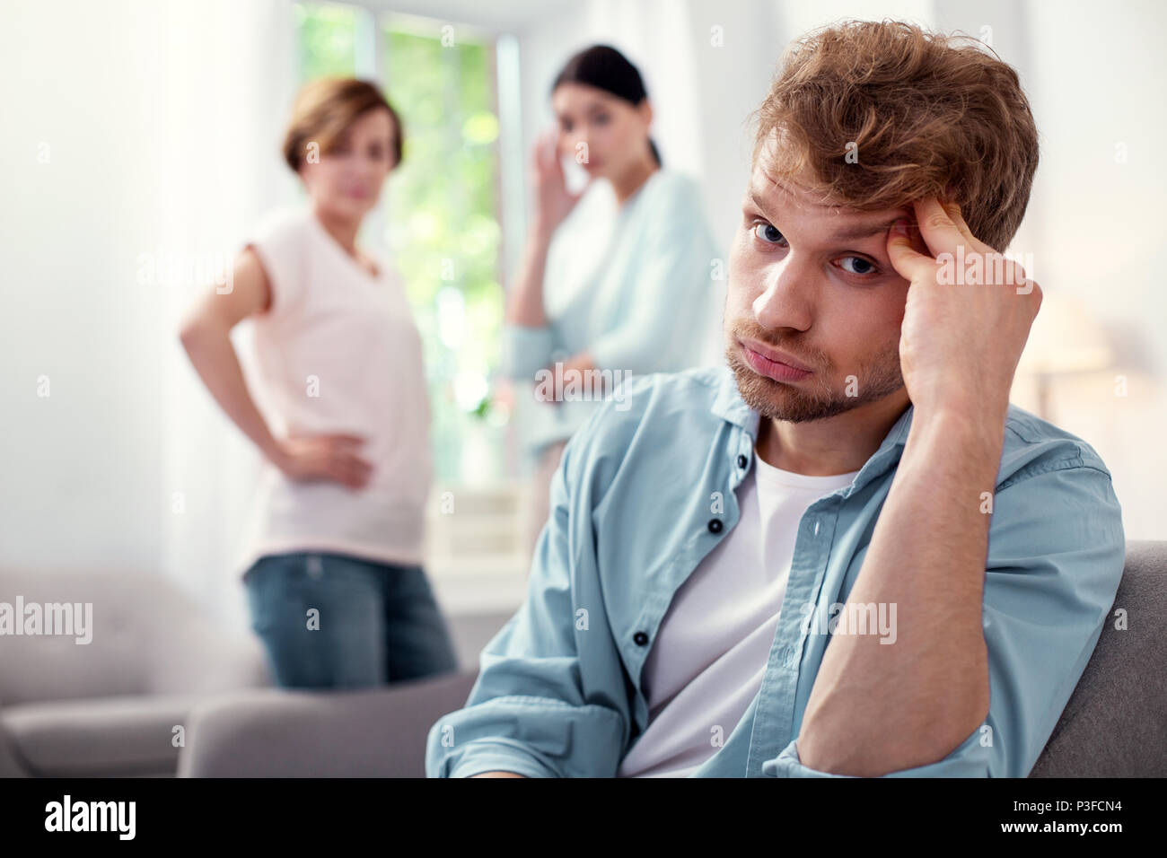 Portrait of a tired young man Stock Photo - Alamy