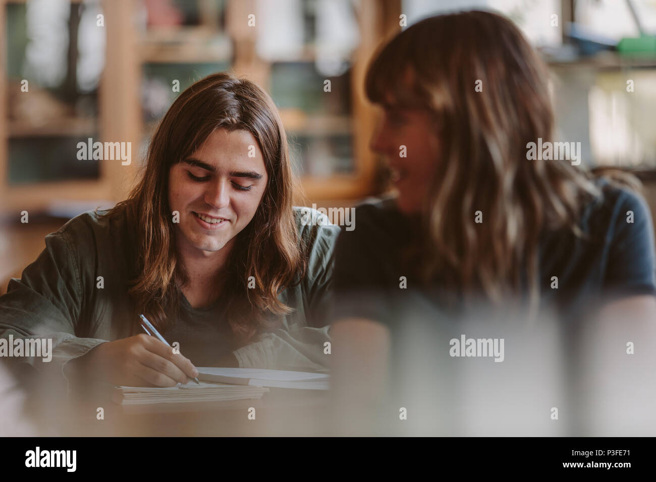 Writing a book student hi-res stock photography and images - Alamy