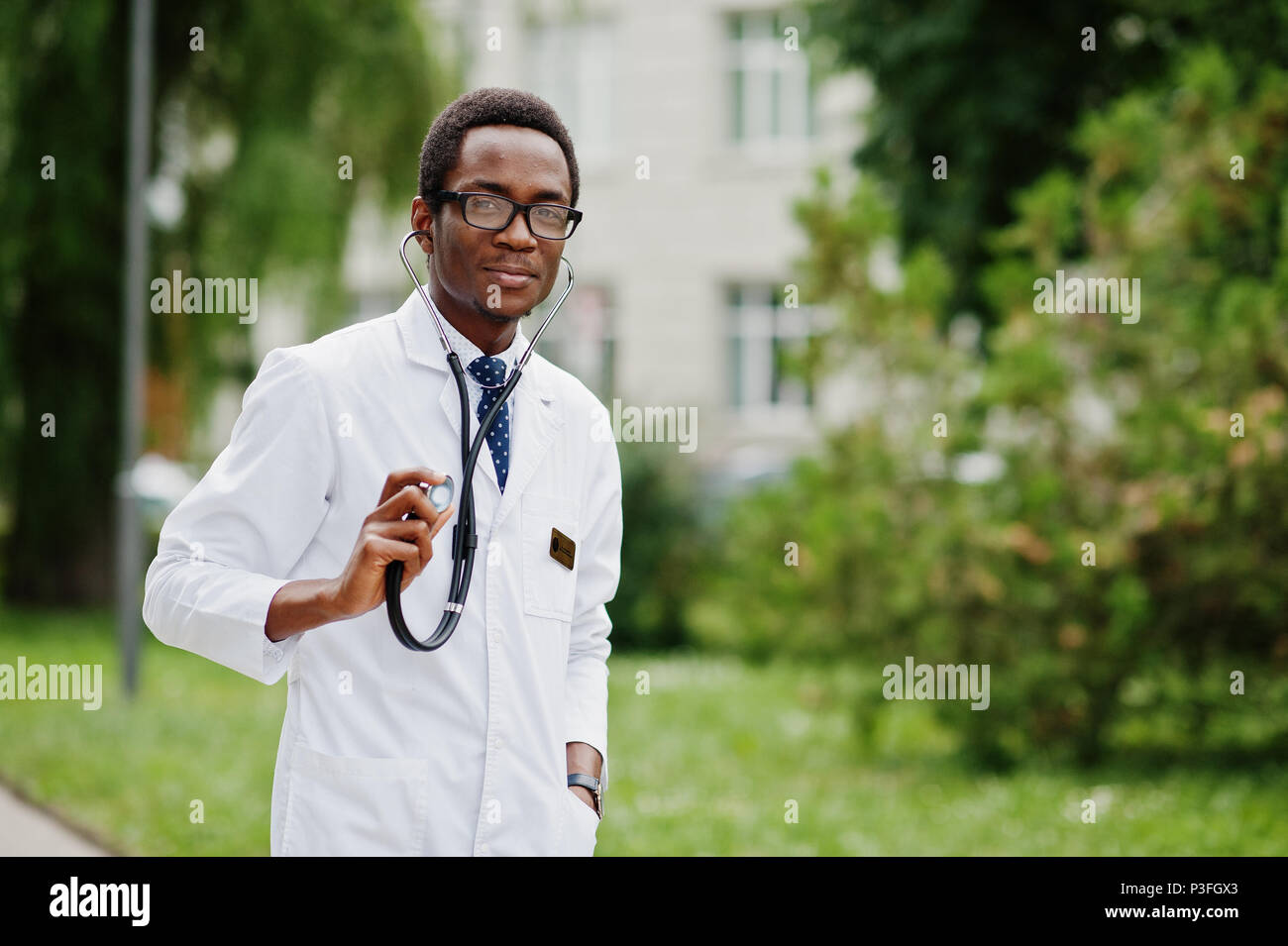 Stylish african american doctor with stethoscope and lab coat, at ...