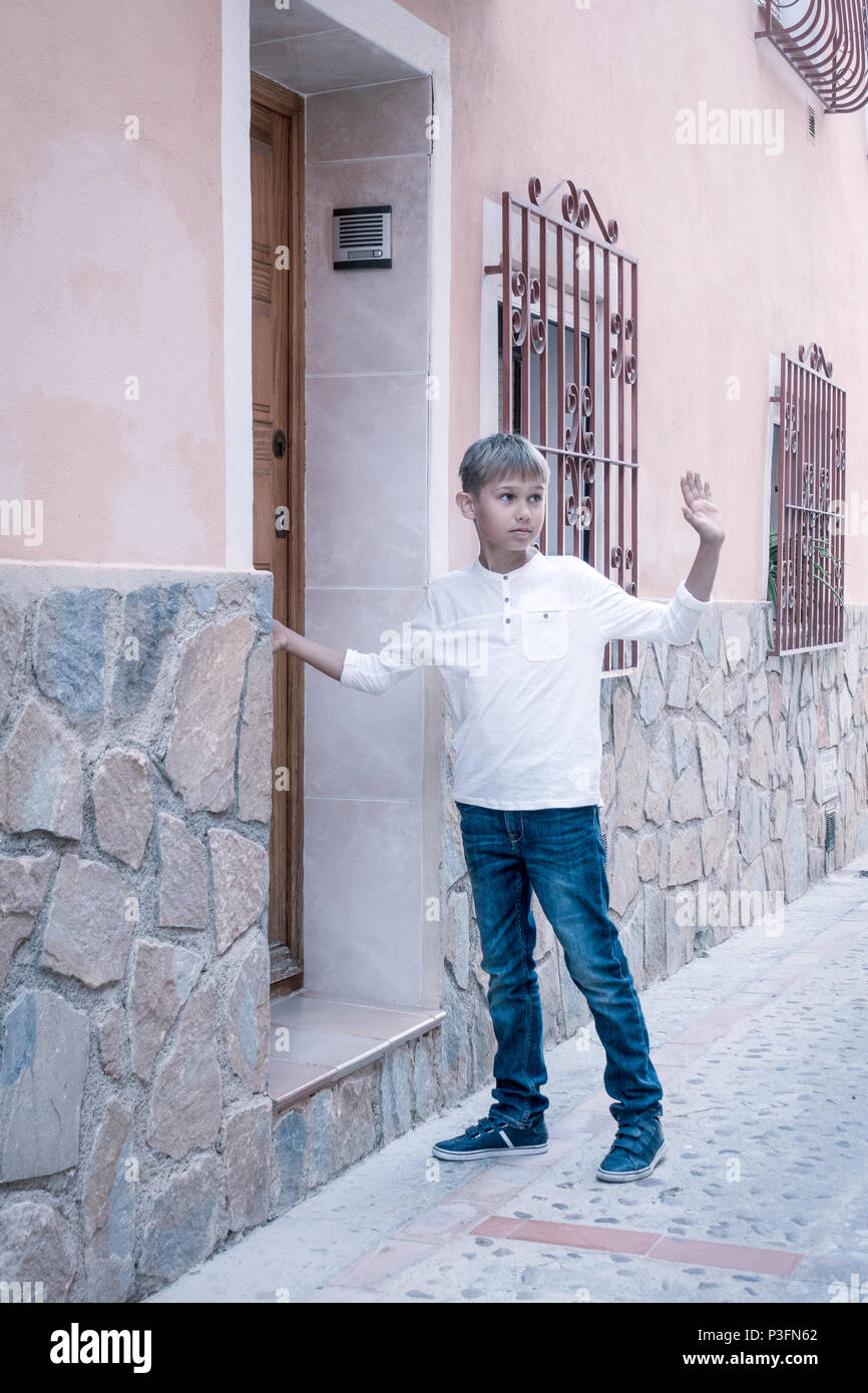 Boy waving goodbye hi-res stock photography and images - Alamy