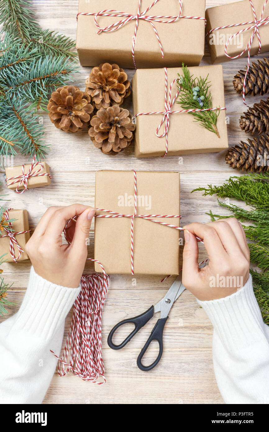 Girl hands wrapping New year gift, gift wrapping process, needlework ...