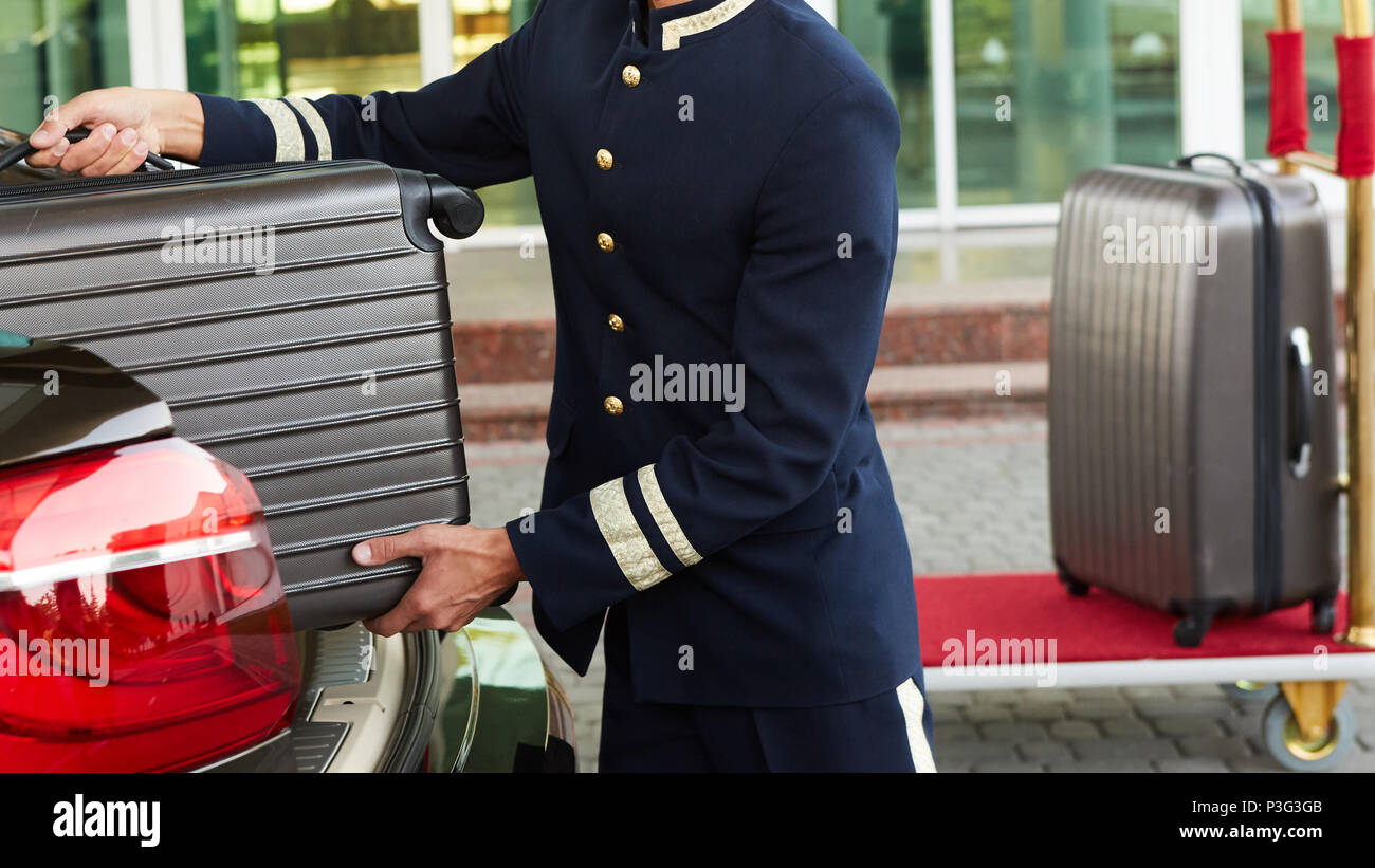 Hotel doorman and reception and lobby hi-res stock photography and ...