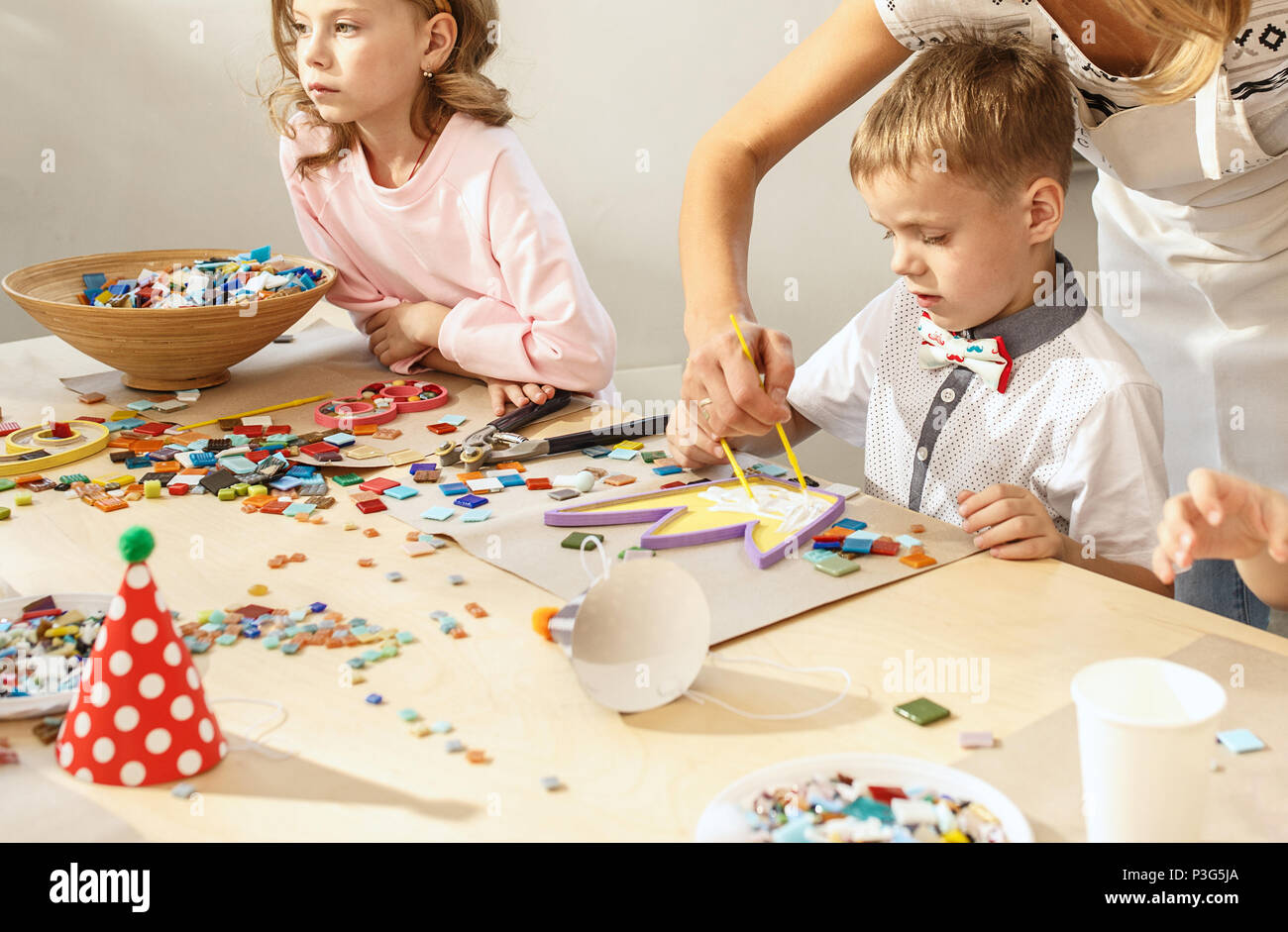 mosaic puzzle art for kids, children's creative game. two sisters are ...