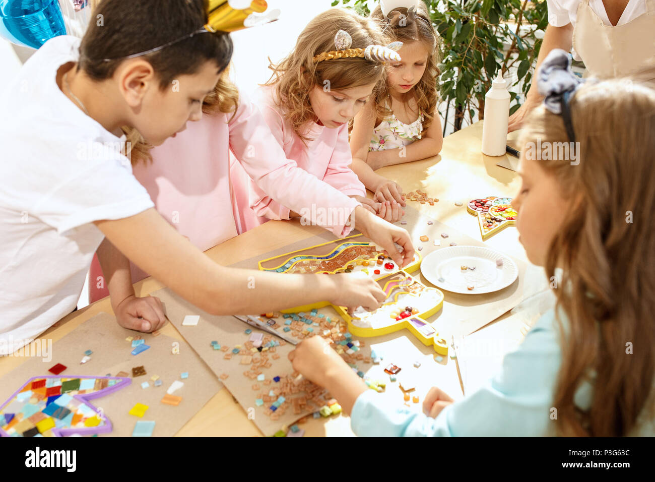mosaic puzzle art for kids, children's creative game Stock Photo - Alamy