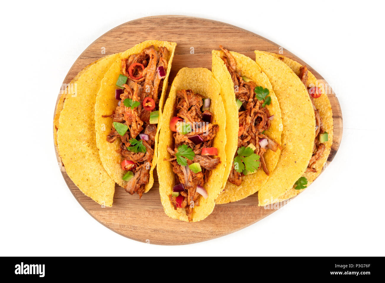 An overhead photo of Mexican tacos with pulled pork, avocado, chili ...