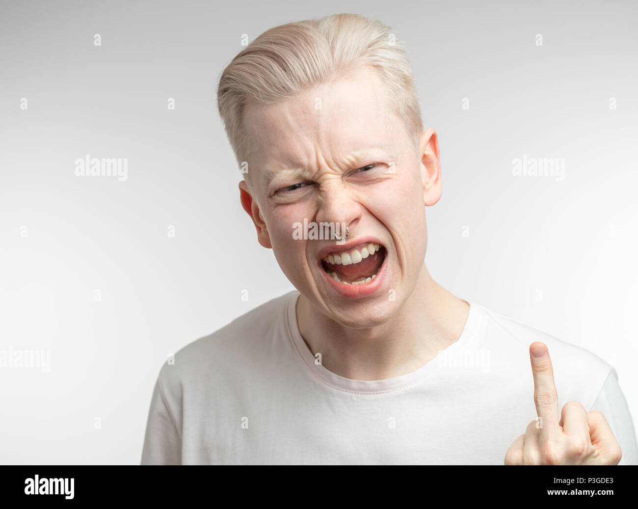 Outraged man gestures angrily, being irritated, outraged Stock Photo ...