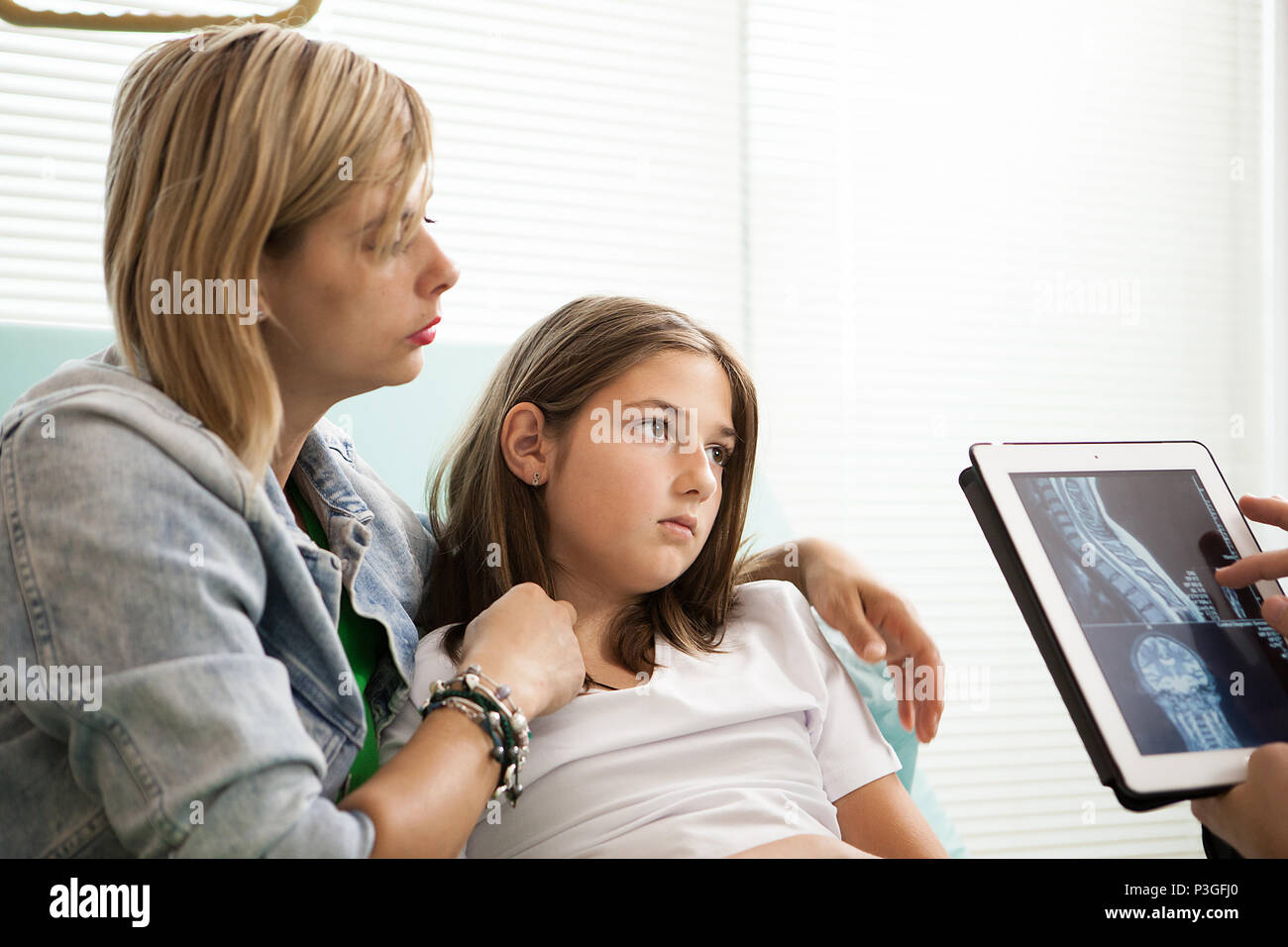 Doctor checking the xray on his tablet pc Stock Photo - Alamy
