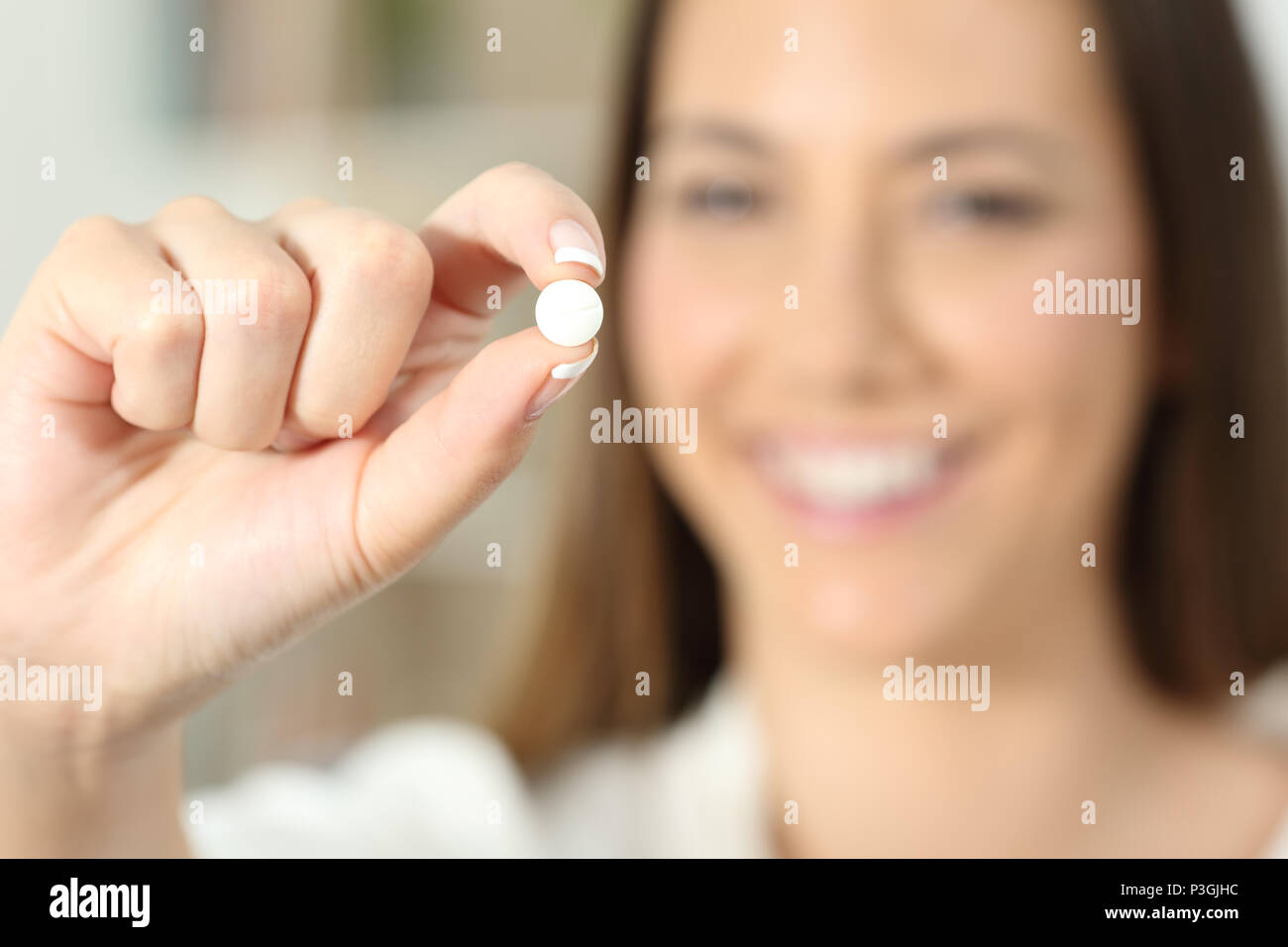 Girl giving pill hi-res stock photography and images - Alamy