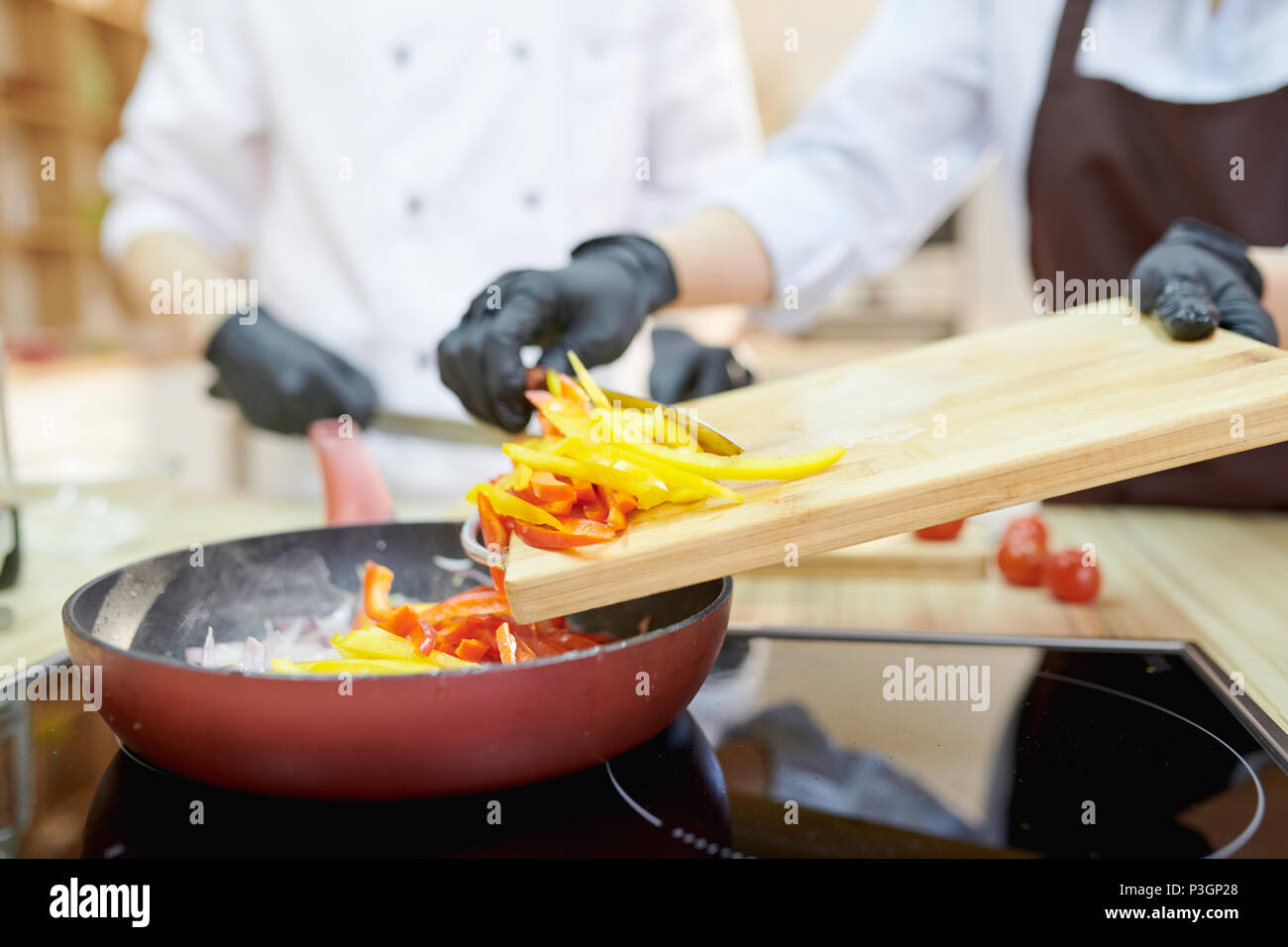 Chefs Cooking in Restaurant Kitchen Stock Photo - Alamy