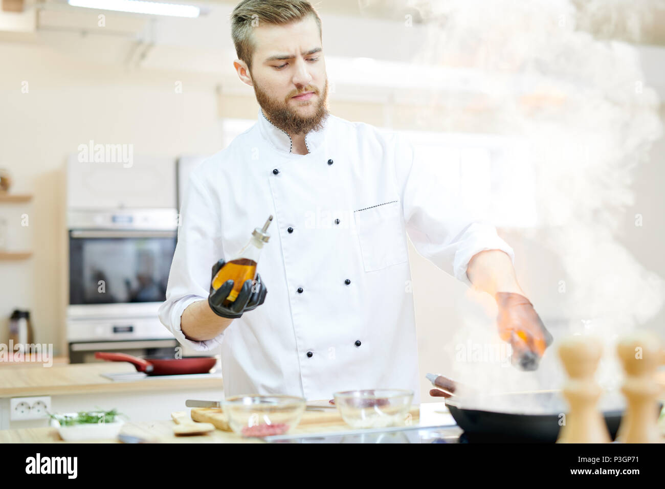 Handsome Chef Busy Cooking Stock Photo - Alamy