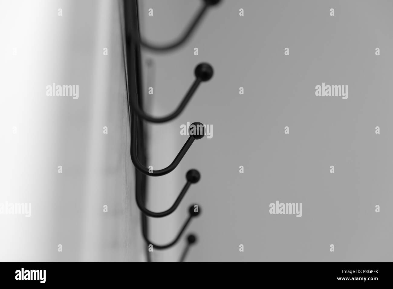 Multiple hooks for cloth close up Stock Photo - Alamy