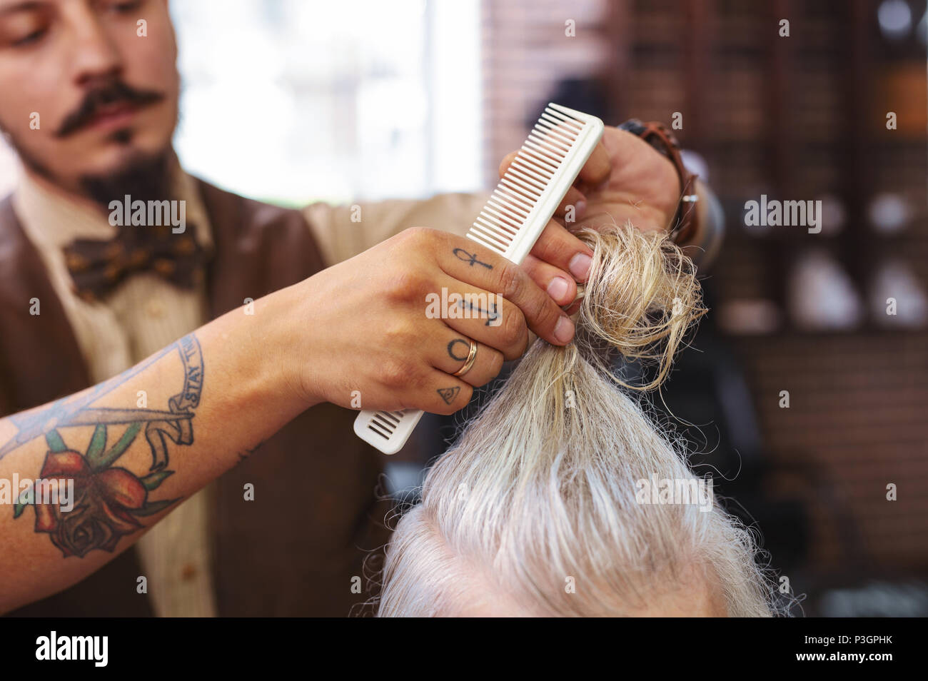 Professional master refreshing hair for client Stock Photo - Alamy