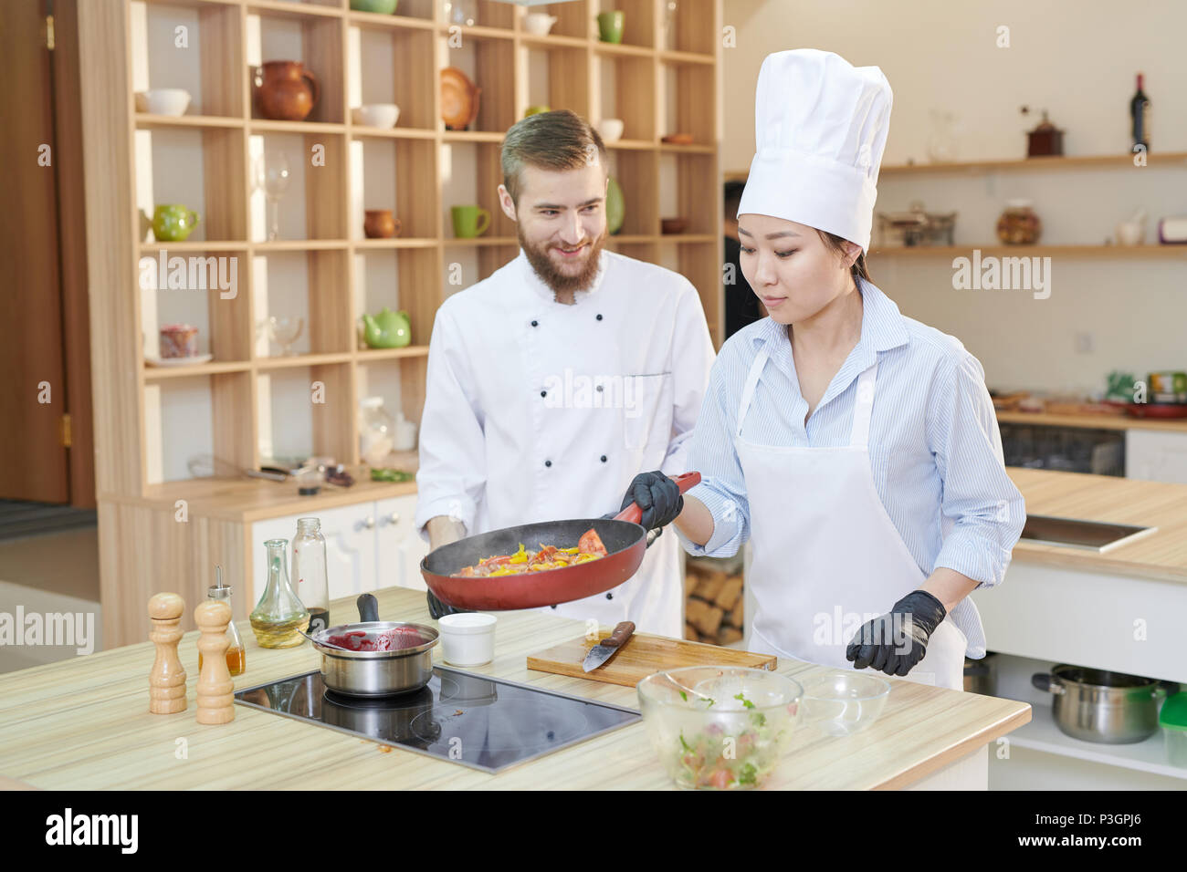 Two Professional Chefs at Work Stock Photo - Alamy