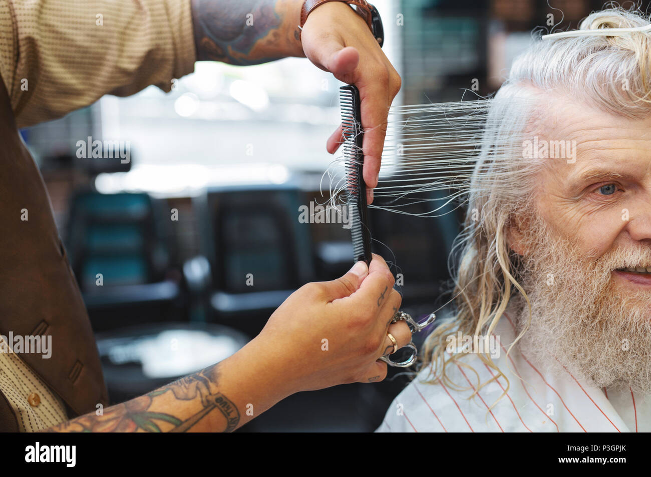 Modern barber holding scissors hi-res stock photography and images - Alamy
