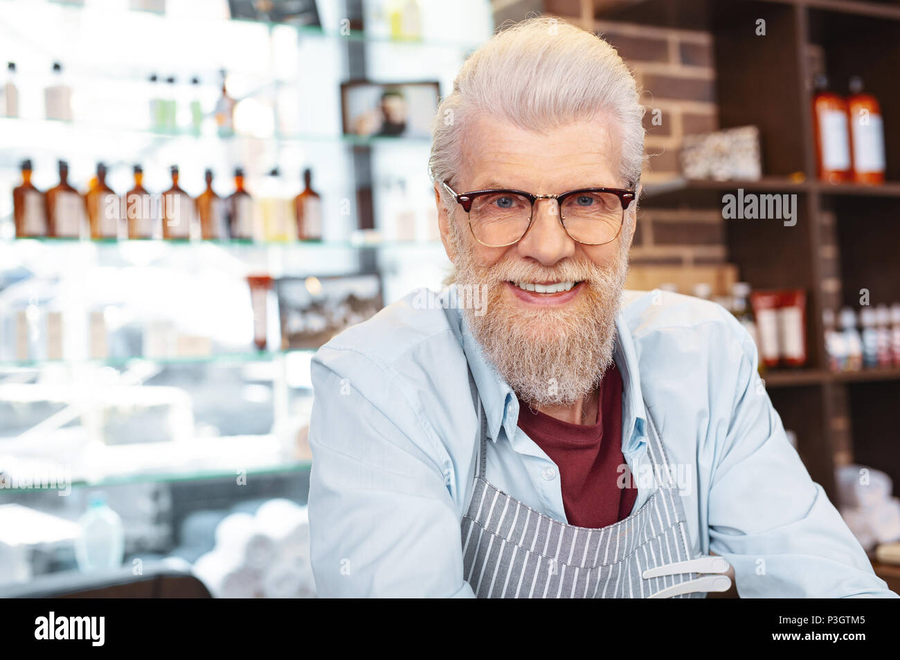 Stylish male person working in salon Stock Photo - Alamy