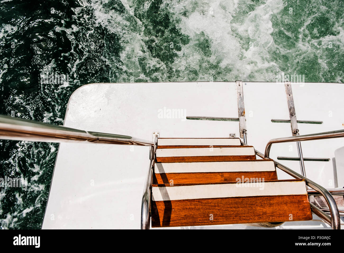 Wave trace on sea water surface behind of fast moving power boat. Rear ...