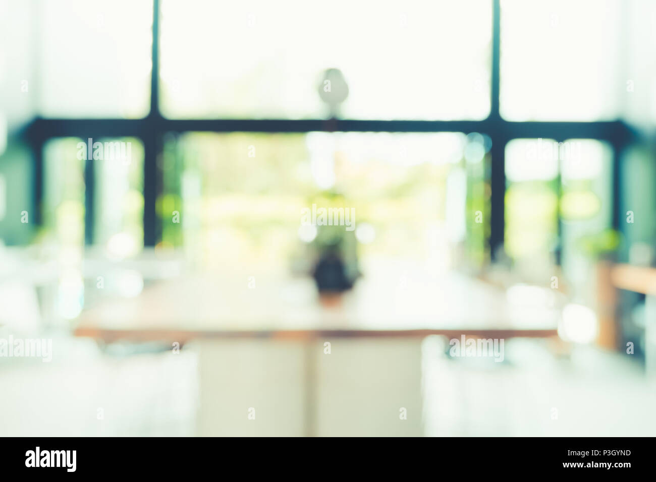 Blurred background modern kitchen and dinning room in house with bokeh ...