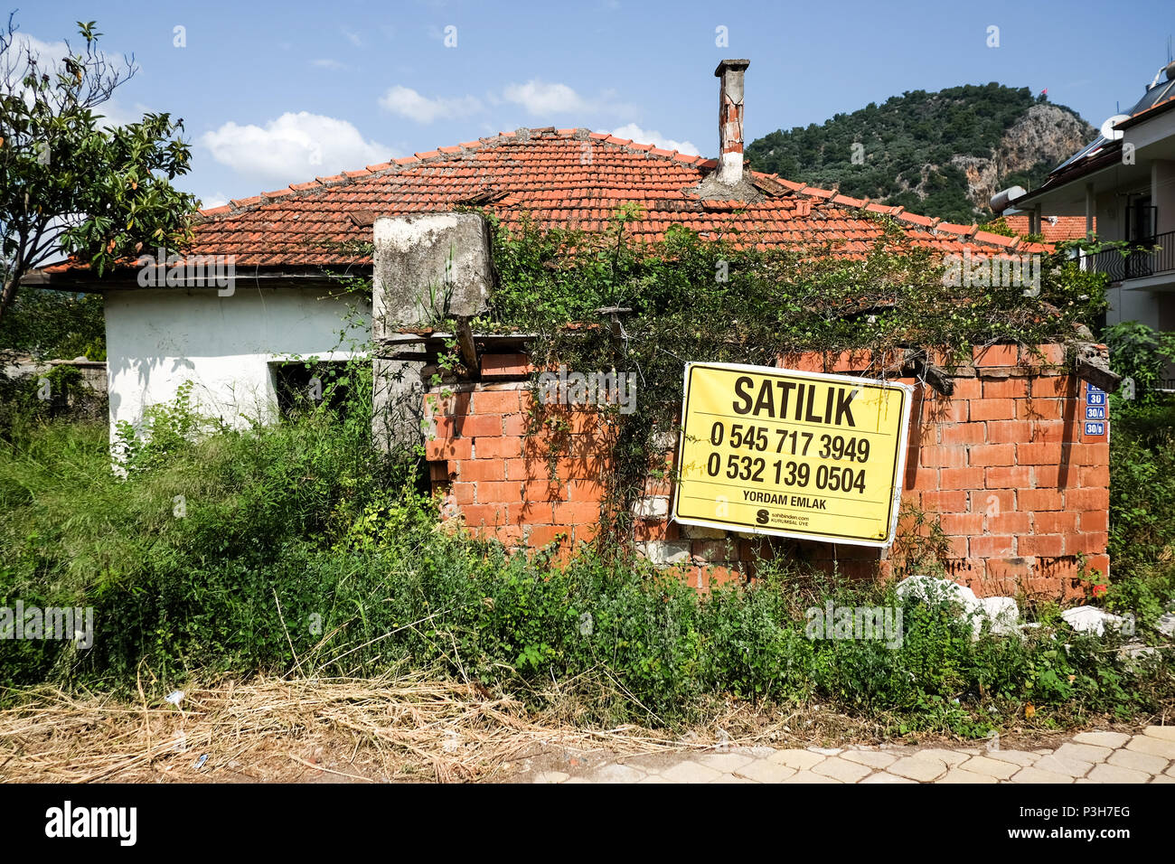 26.05.2018, Dalyan, Turkey: A sign "Satilik" for "for sale" is attached ...