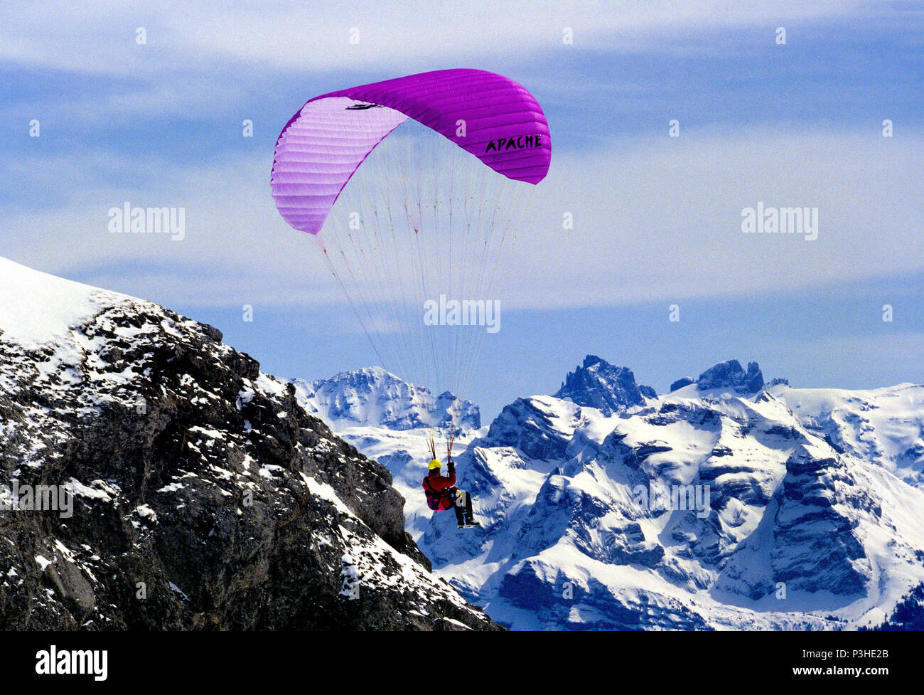 A paraglider against a mountain backdrop in the Bernese Alps, undated ...