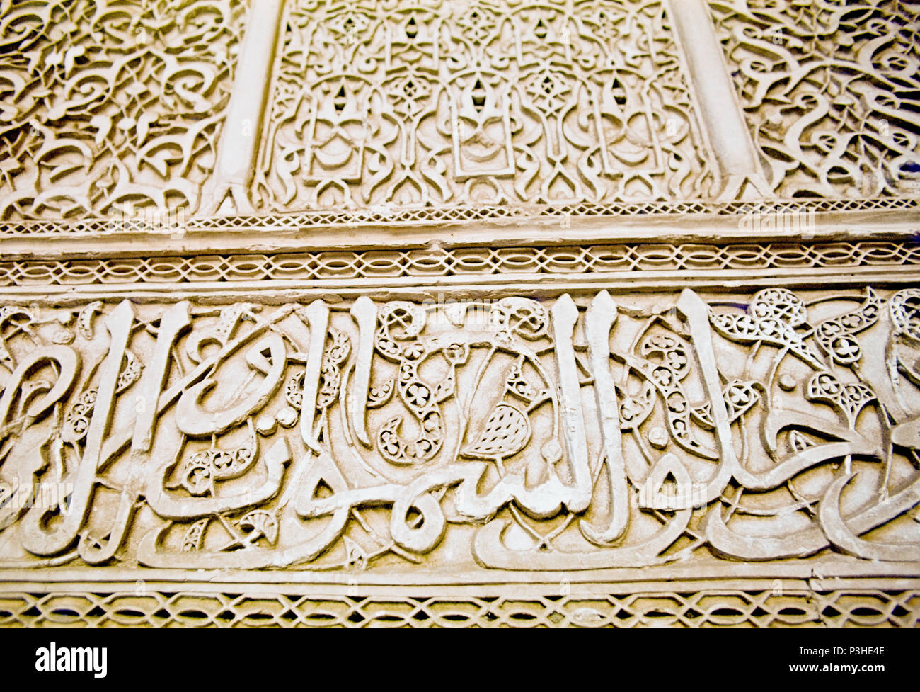 Ornate stone carvings on the wall of a mosque in the form of Koran ...