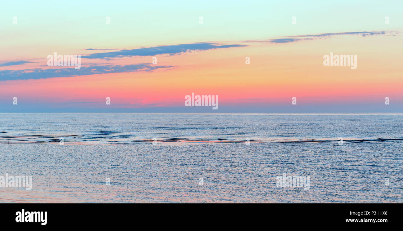 Sun with dark clouds over the baltic sea hi-res stock photography and ...
