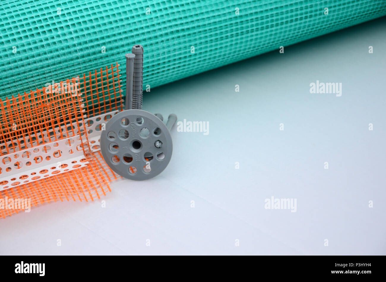 A set of construction items for the insulation of walls. Plastic dowels ...