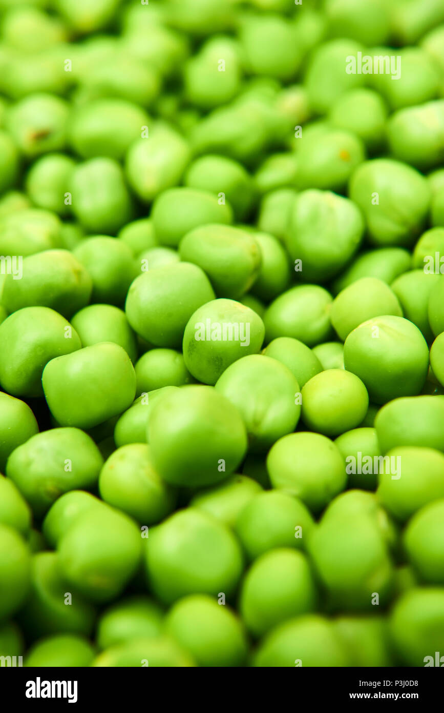 Fresh green peas background texture top view Stock Photo - Alamy