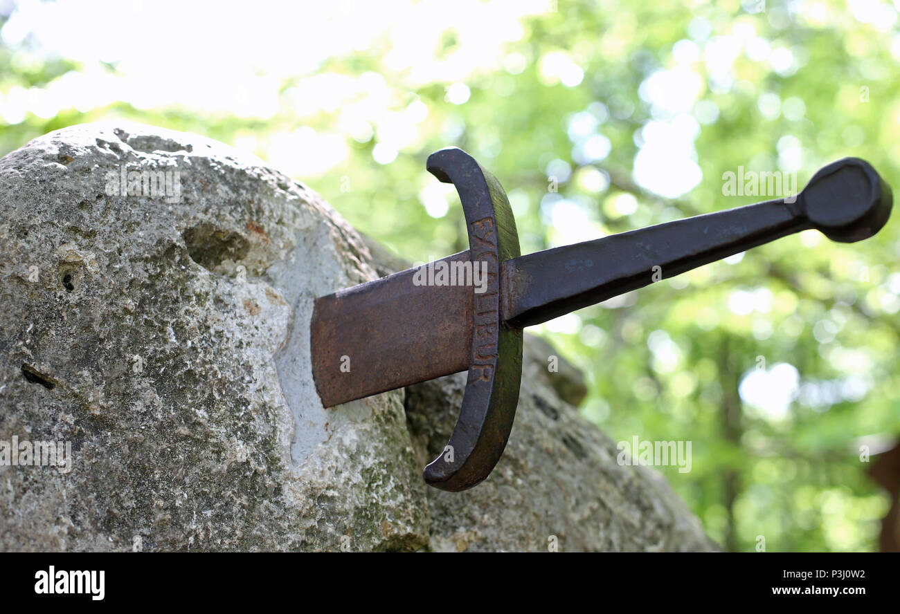 Magic Sword with text EXCALIBUR in the stone Stock Photo - Alamy