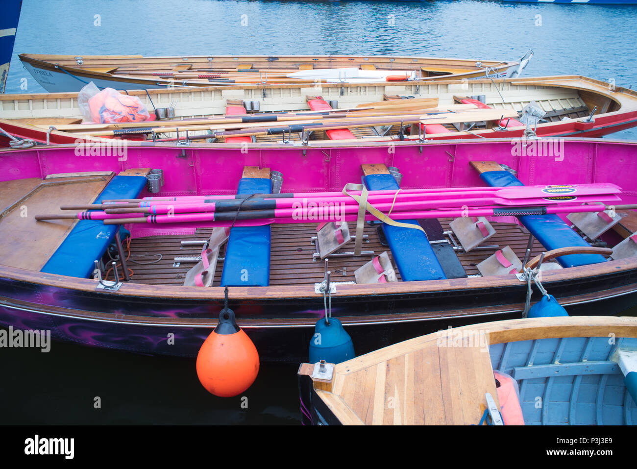 traditional rowing boats in striking colors in a dutch harbor Stock ...