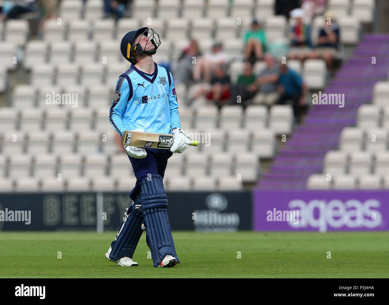 Yorkshire's Jonathan Tattersall looks dejected as he leaves the field ...