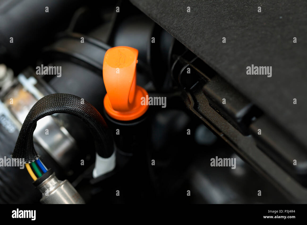 Creek rod checking the oil level in the engine Stock Photo - Alamy
