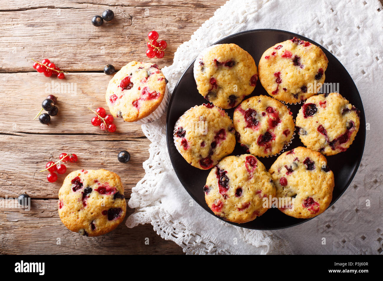 Summer dessert: muffins with a berry mix of currants close-up on the ...