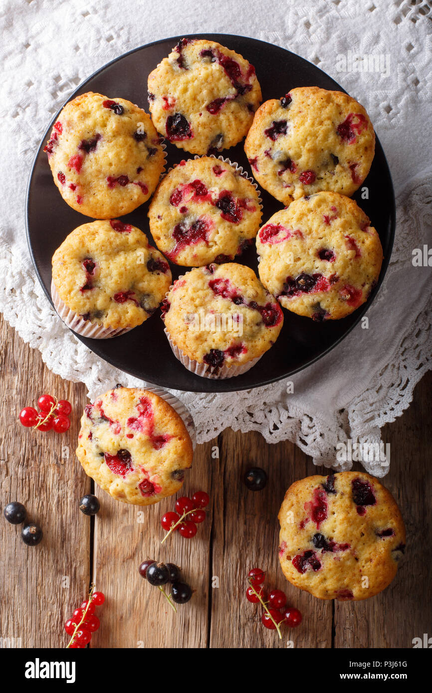 Summer dessert: muffins with a berry mix of currants close-up on the ...