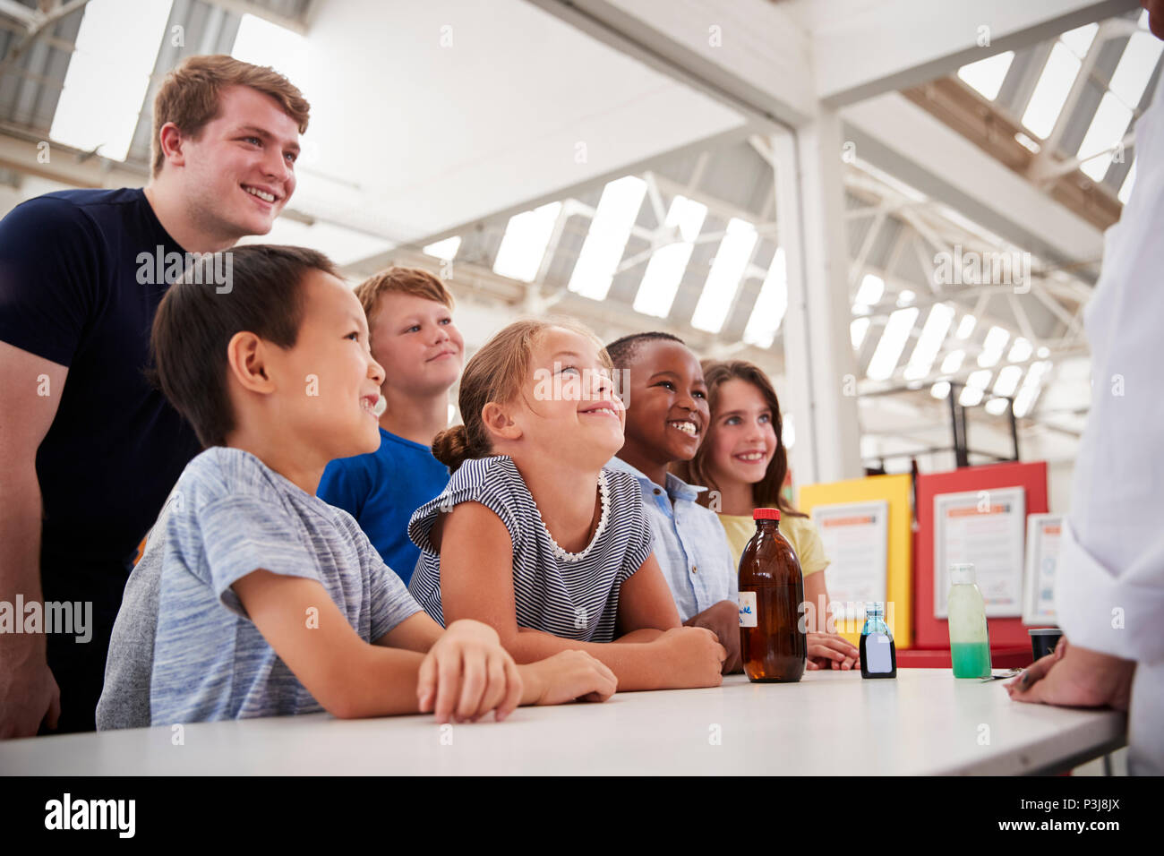 Group of kids with teachers having fun at a science centre Stock Photo ...