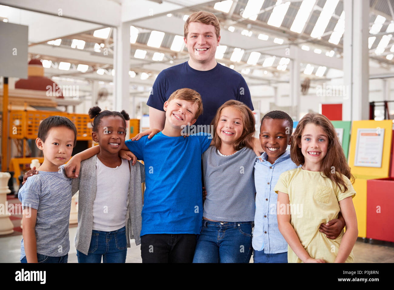 Classmates and teacher posing for photo at a science centre Stock Photo ...