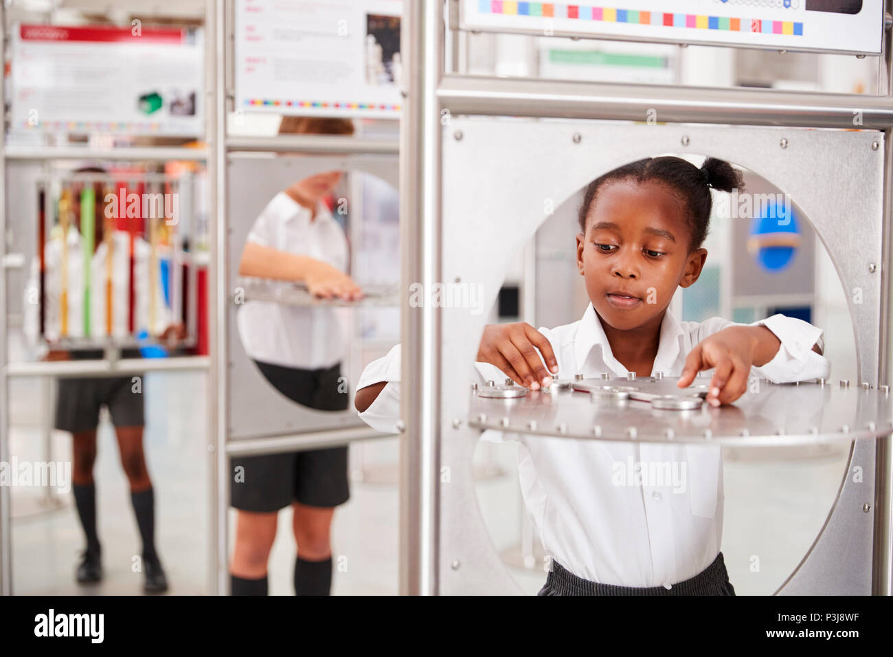 School kids taking part in science tests at a science centre Stock ...
