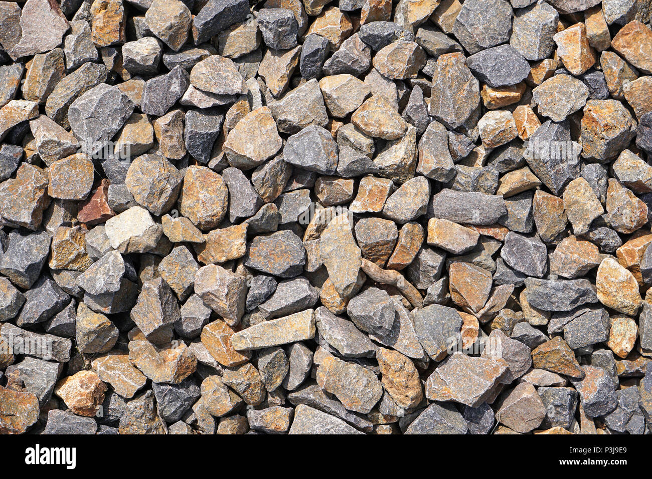 Stones on the ground background Stock Photo - Alamy
