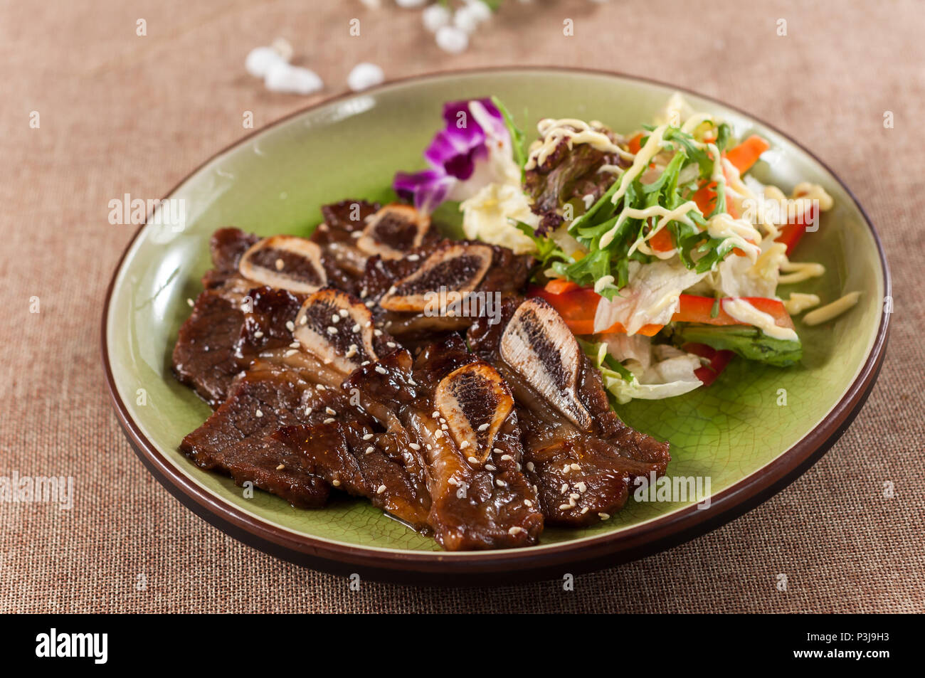 Beef Short Ribs with salad Stock Photo - Alamy