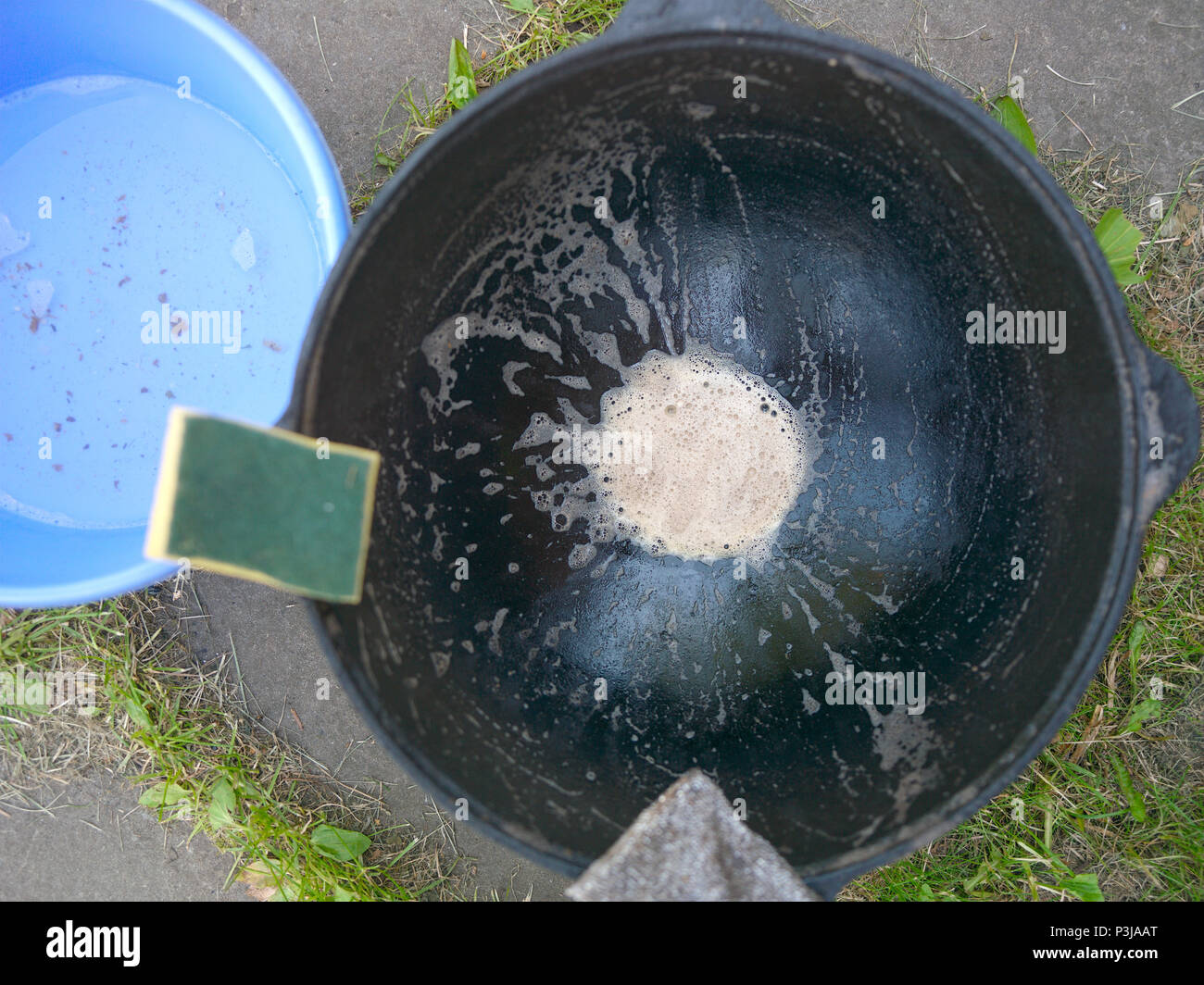 Cast iron pot cleaning hi-res stock photography and images - Alamy