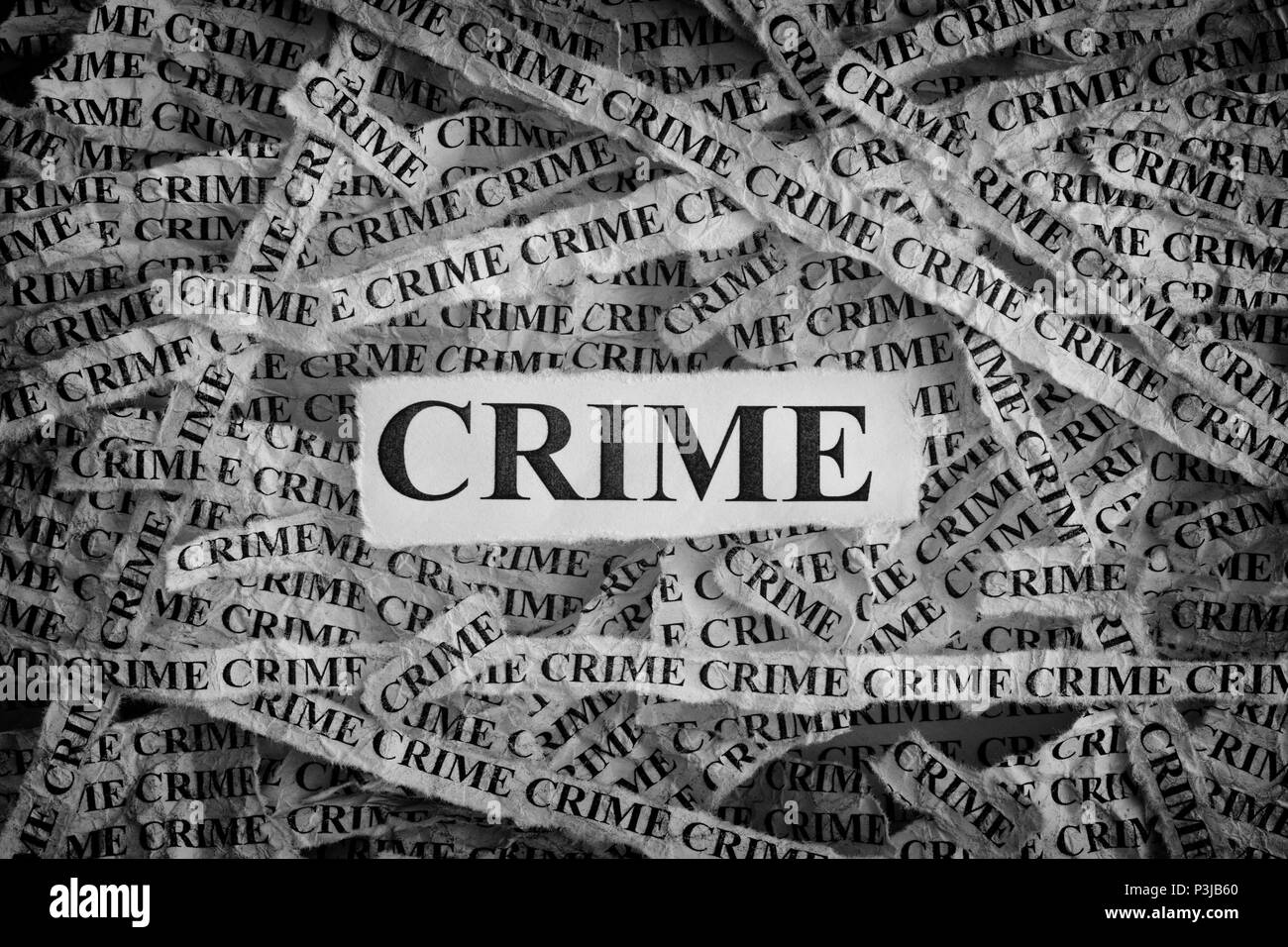 Crime. Torn pieces of paper with the words Crime. Concept Image. Black ...