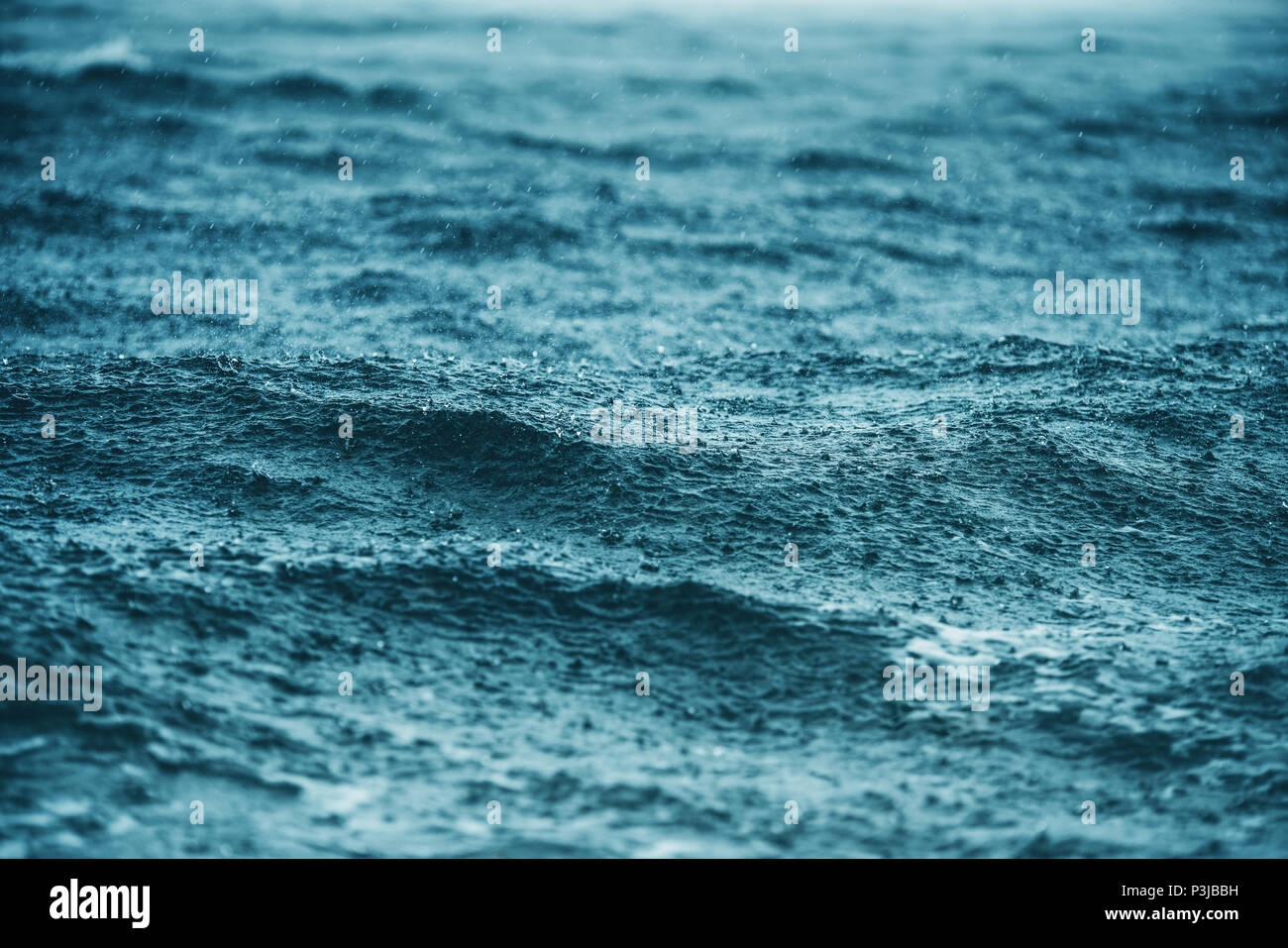 Rain over the sea waves, natural background Stock Photo - Alamy