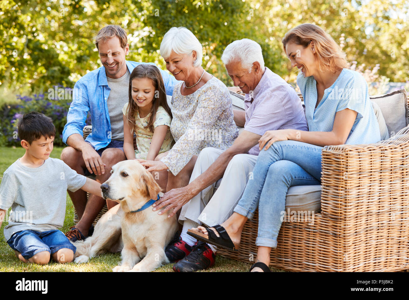 Family with a dog hi-res stock photography and images - Alamy