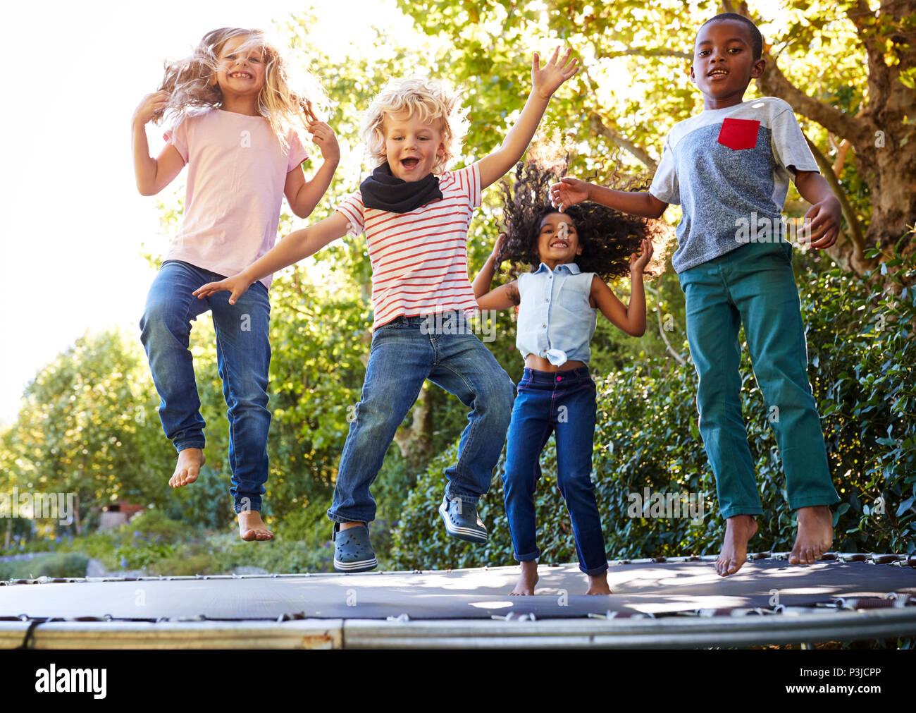 Kids on a trampoline hi-res stock photography and images - Alamy