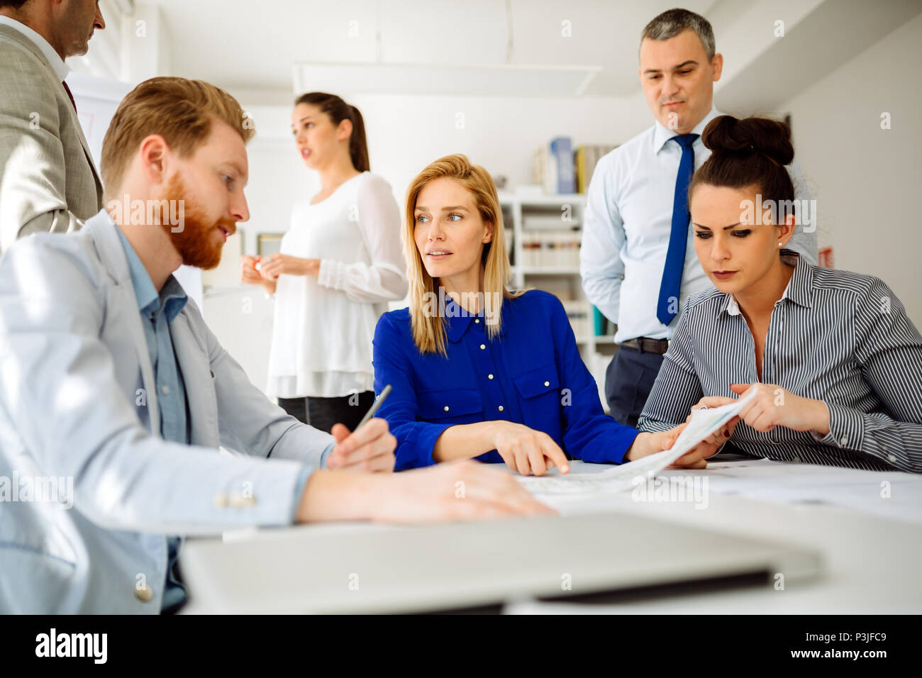 Business people having a board meeting Stock Photo - Alamy