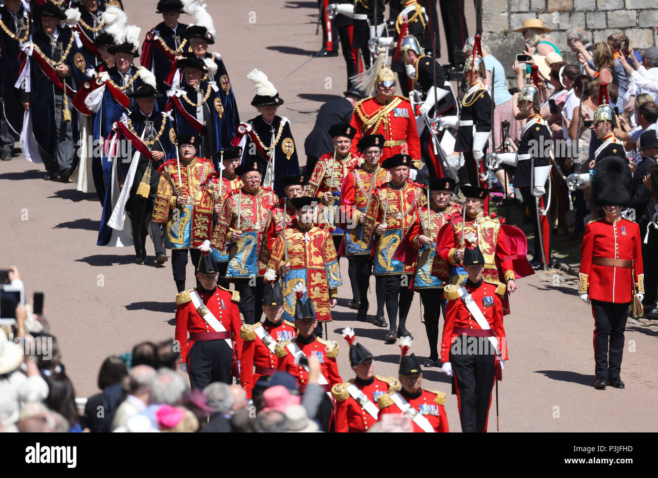Military Knights of Windsor and other guards walk before The Knights of ...