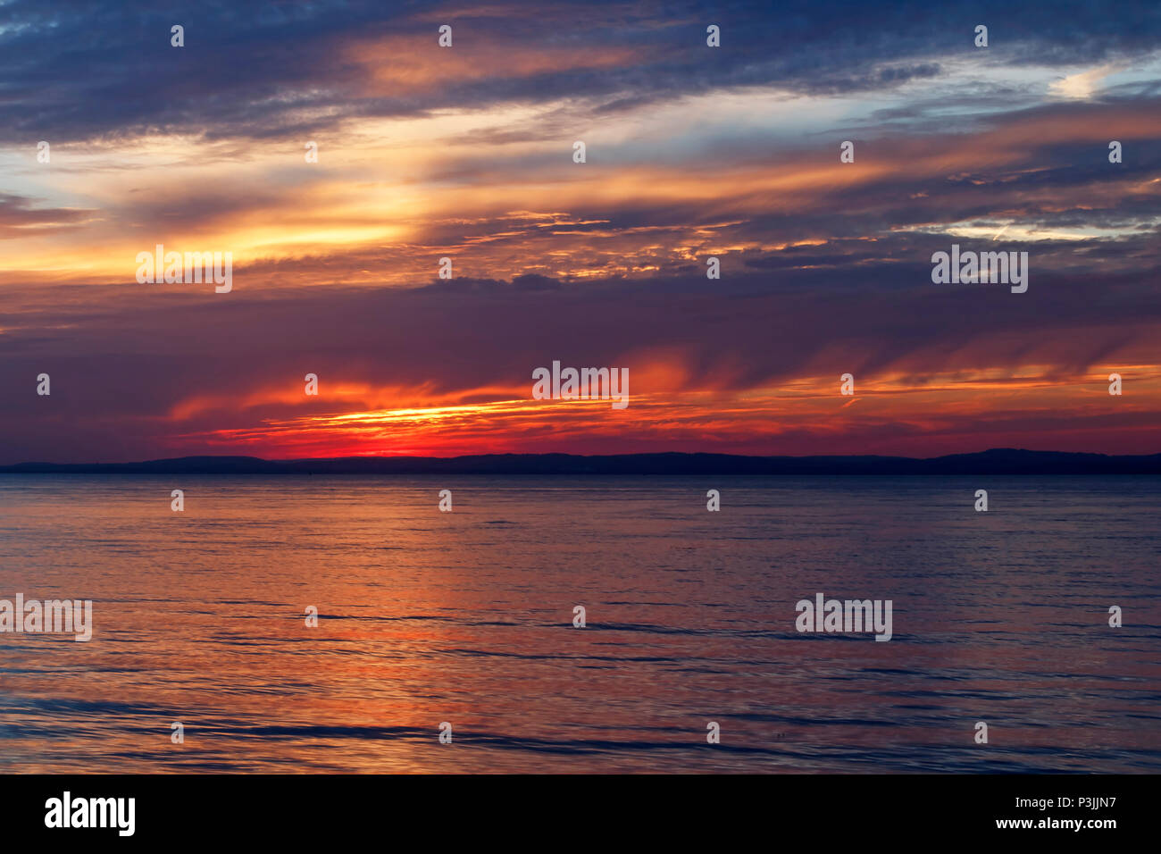 Sun setting over Cardiff Stock Photo - Alamy