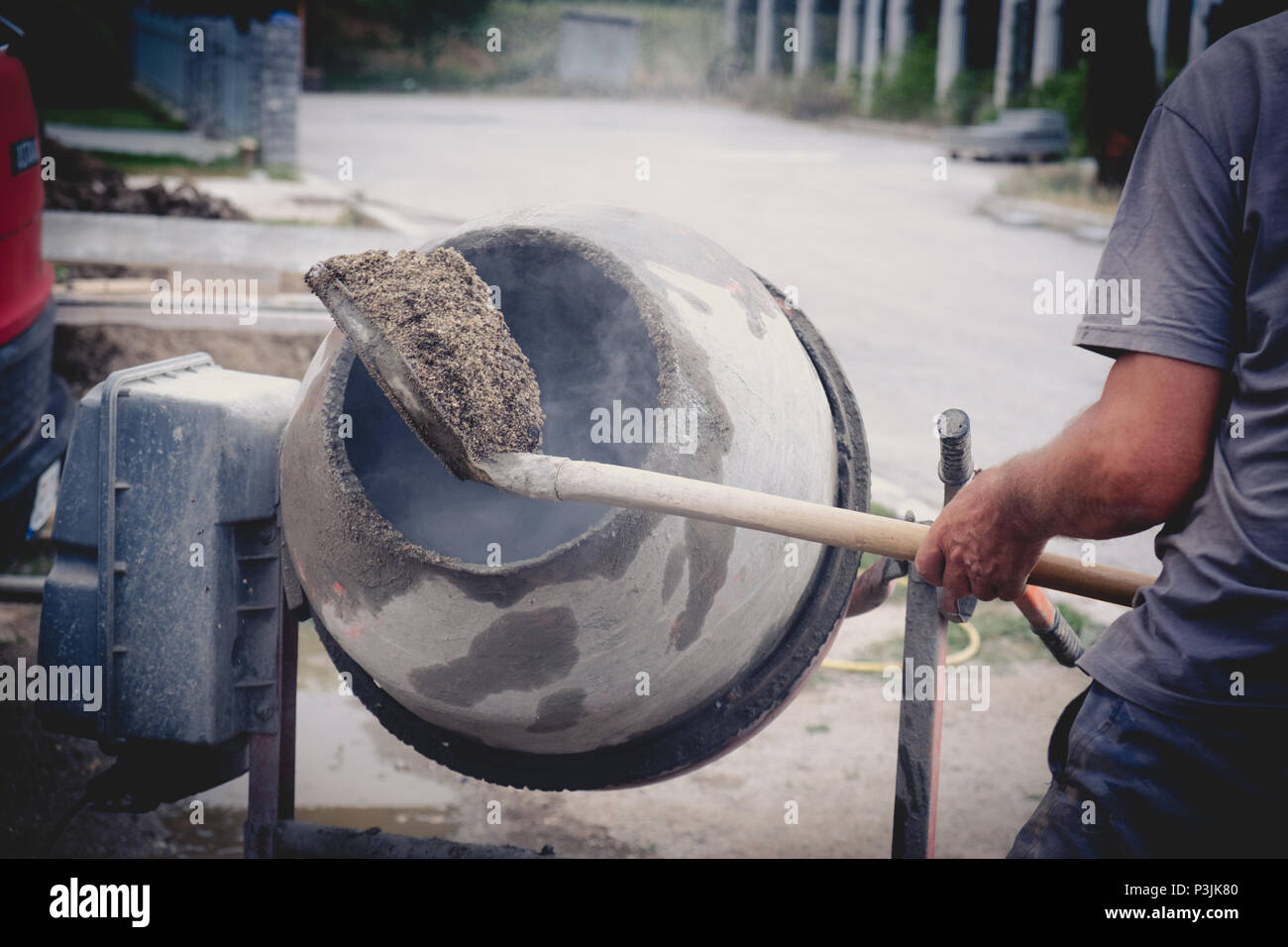 Hand mixing concrete shovel hi-res stock photography and images - Alamy