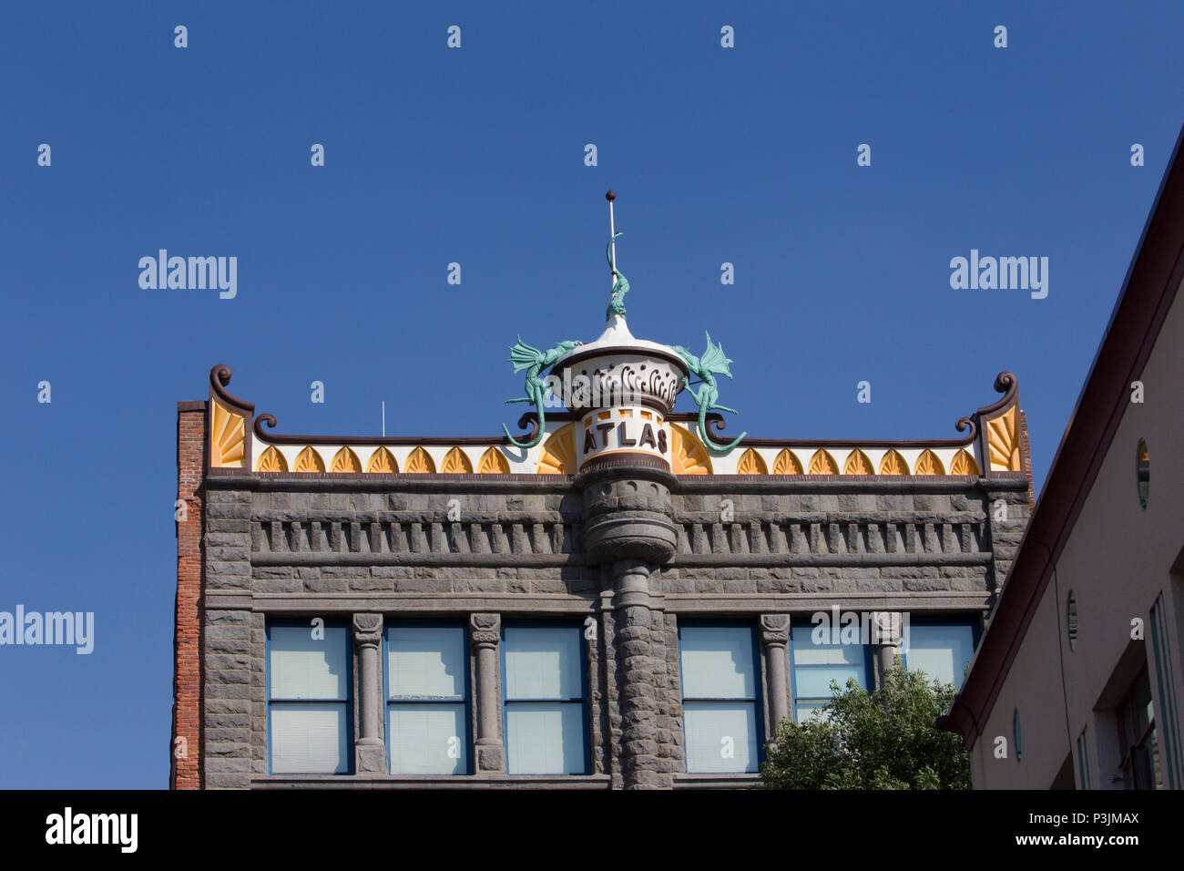 Salamander and lizards top the Atlas Block an insurance building. The ...