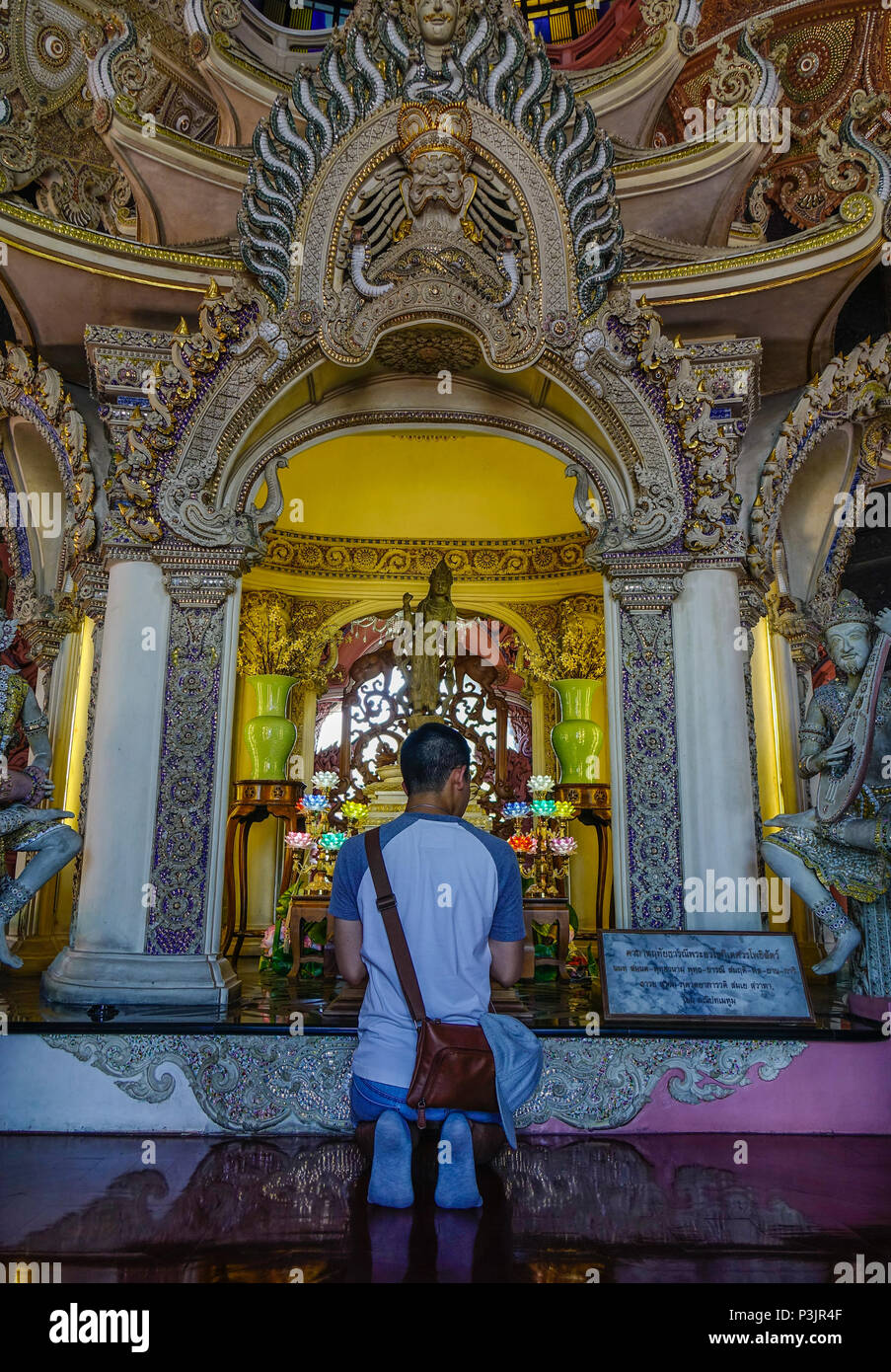 Bangkok, Thailand - Apr 22, 2018. A man praying at the Erawan Temple in ...